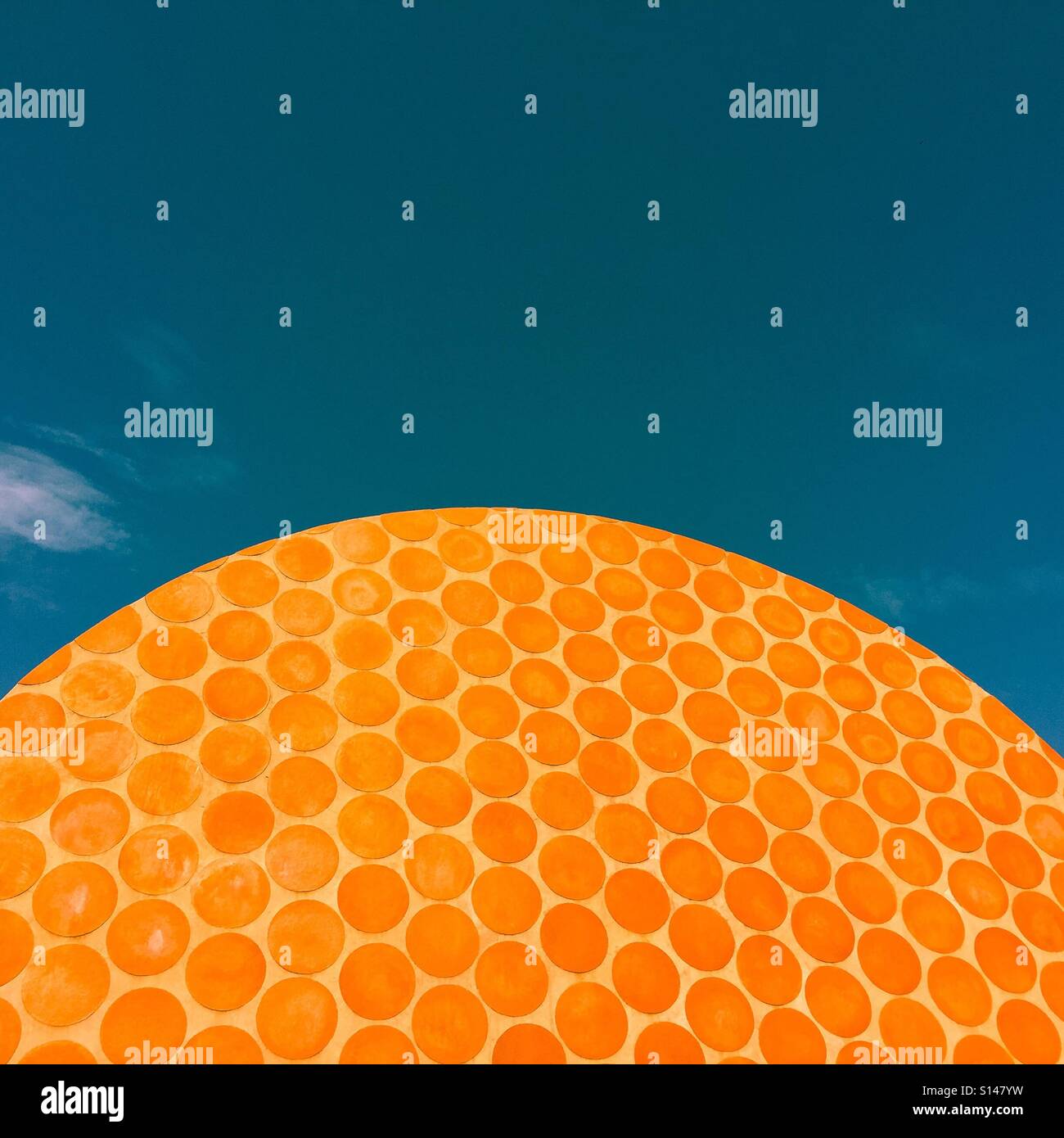 Orange and blue public sculpture by Ángel Garraza in the form of two ...