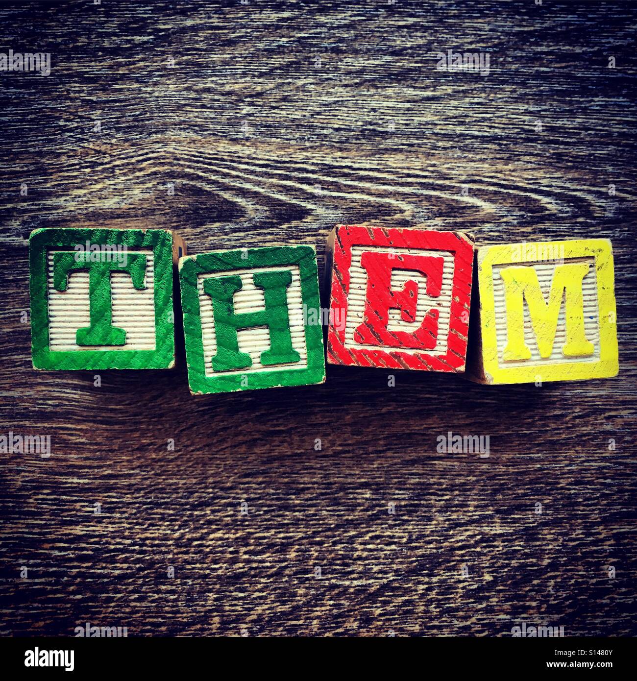 THEM word written with wood block characters Stock Photo - Alamy