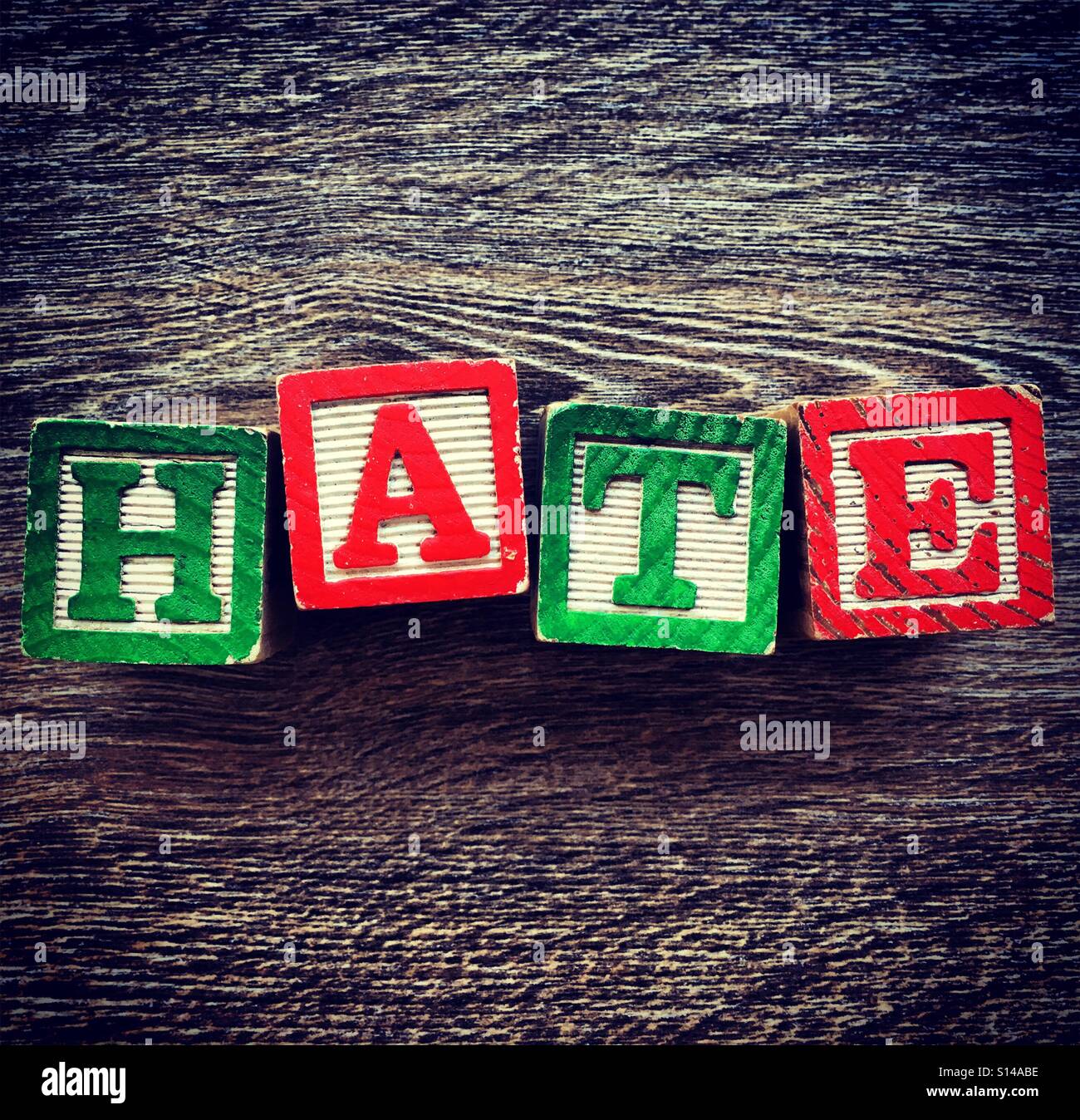 HATE word written with wood block characters Stock Photo - Alamy