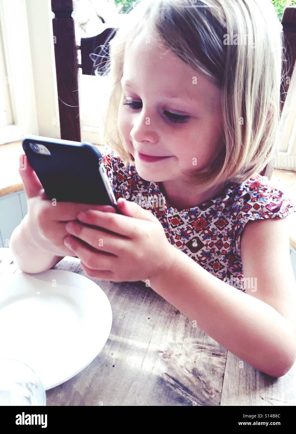 Smiling on iPhone Stock Photo - Alamy