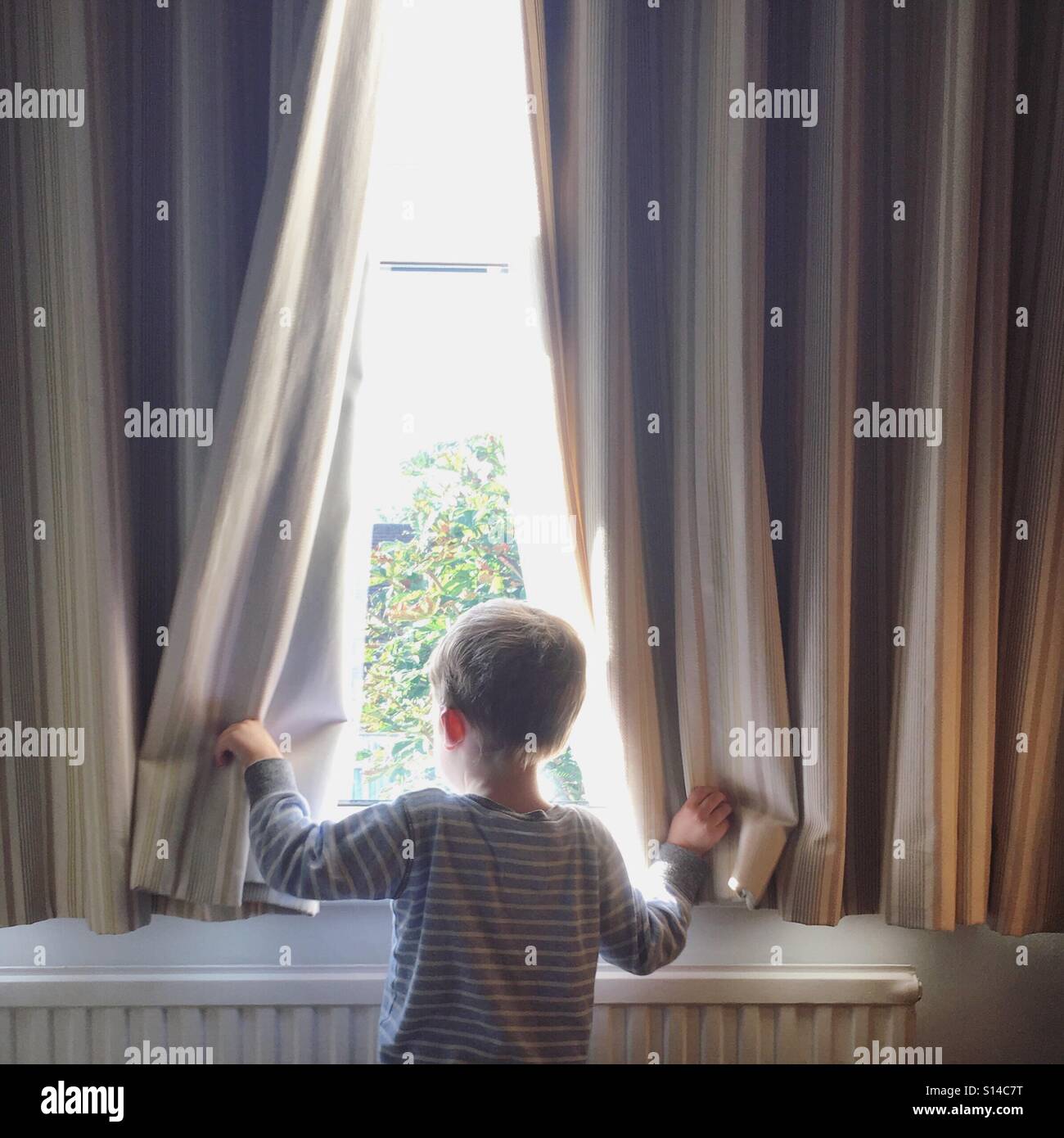 Looking out of the window, watching the world go by Stock Photo - Alamy