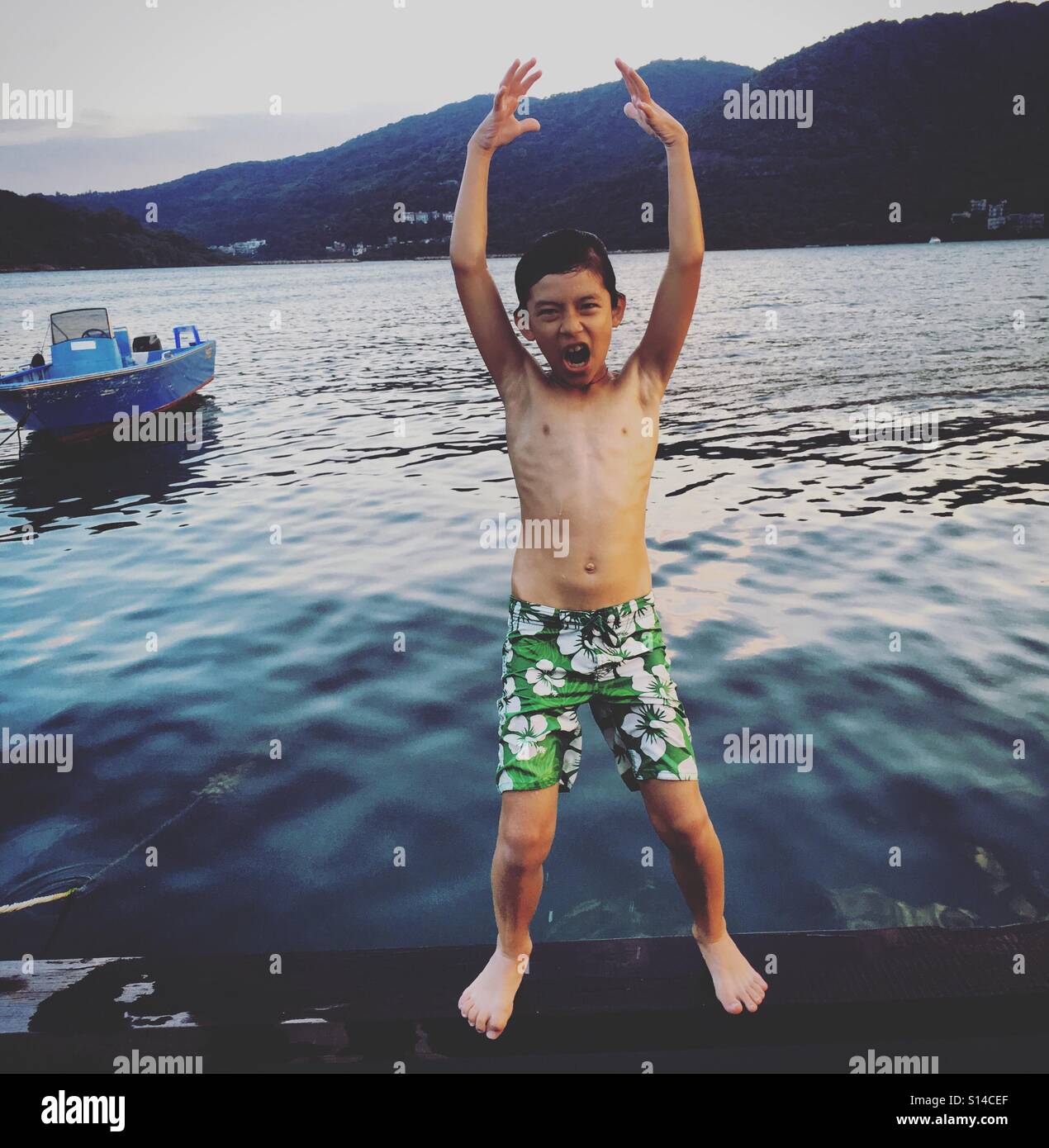 Happy kid by the sea Stock Photo - Alamy