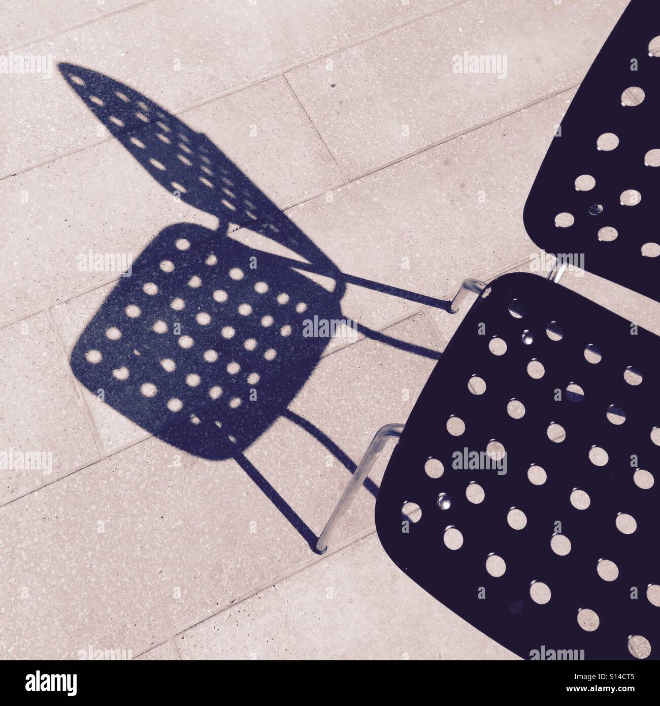 A black chair shadow Stock Photo - Alamy