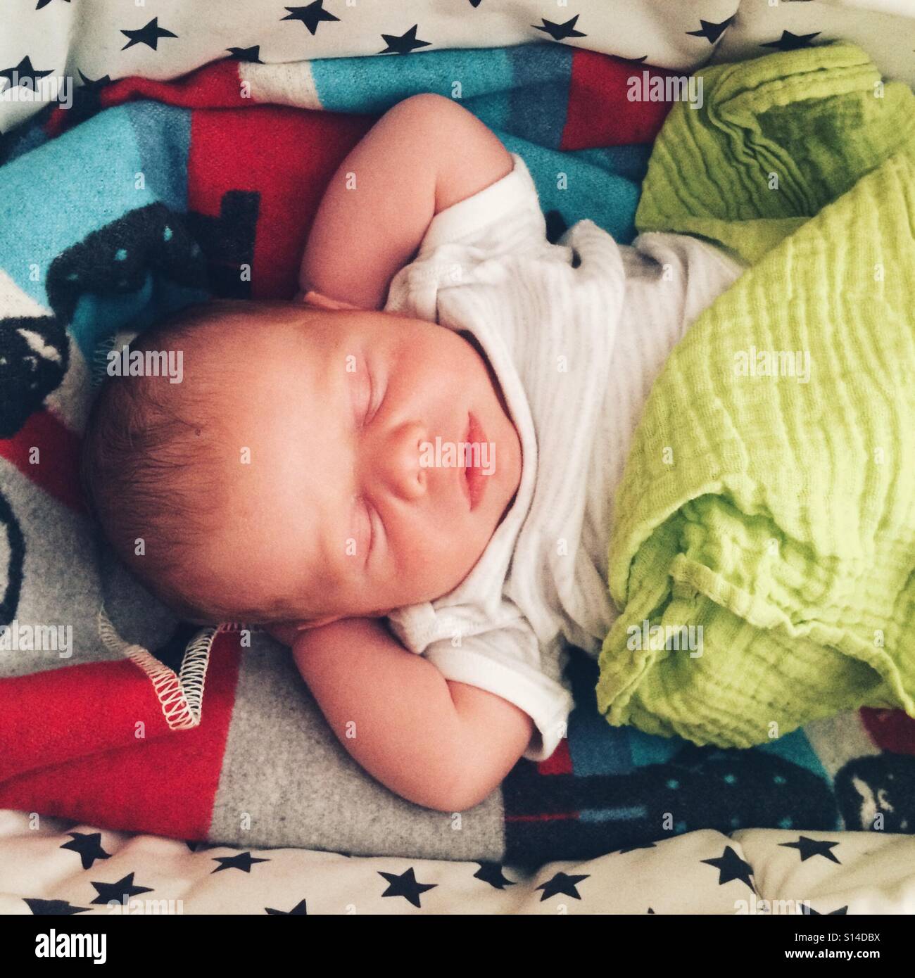 Two week old baby boy sleeping Stock Photo - Alamy