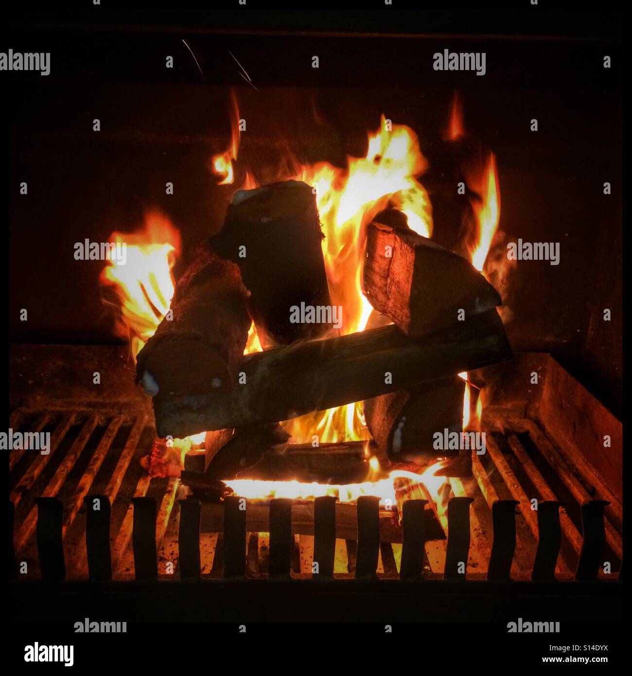 Fire burning in fireplace Stock Photo - Alamy