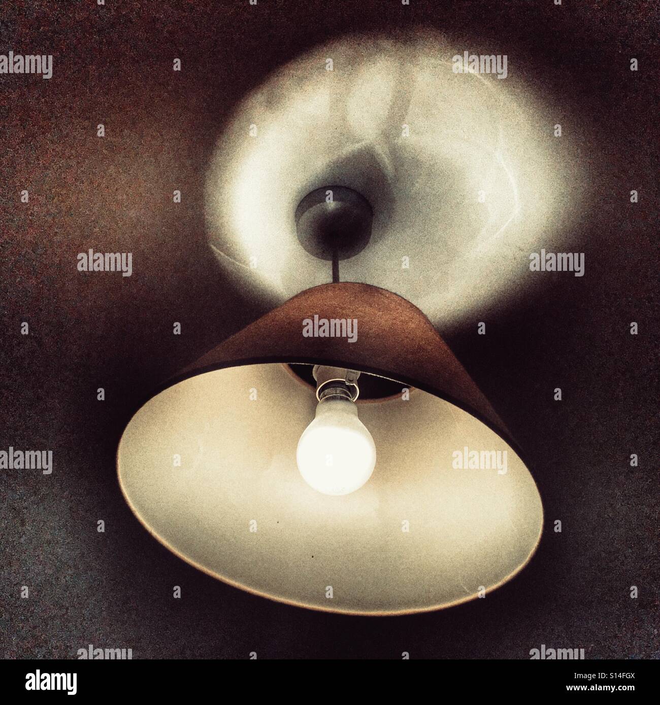 Ceiling light with crooked lampshade Stock Photo - Alamy