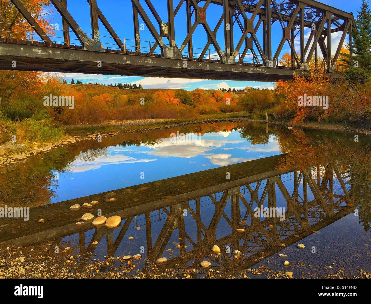 Train bridge reflection Stock Photo - Alamy