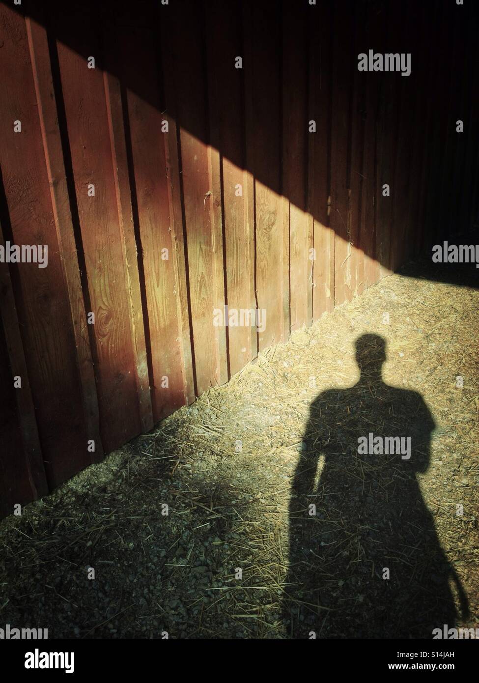 Triangle light and shade at farmyard Stock Photo - Alamy