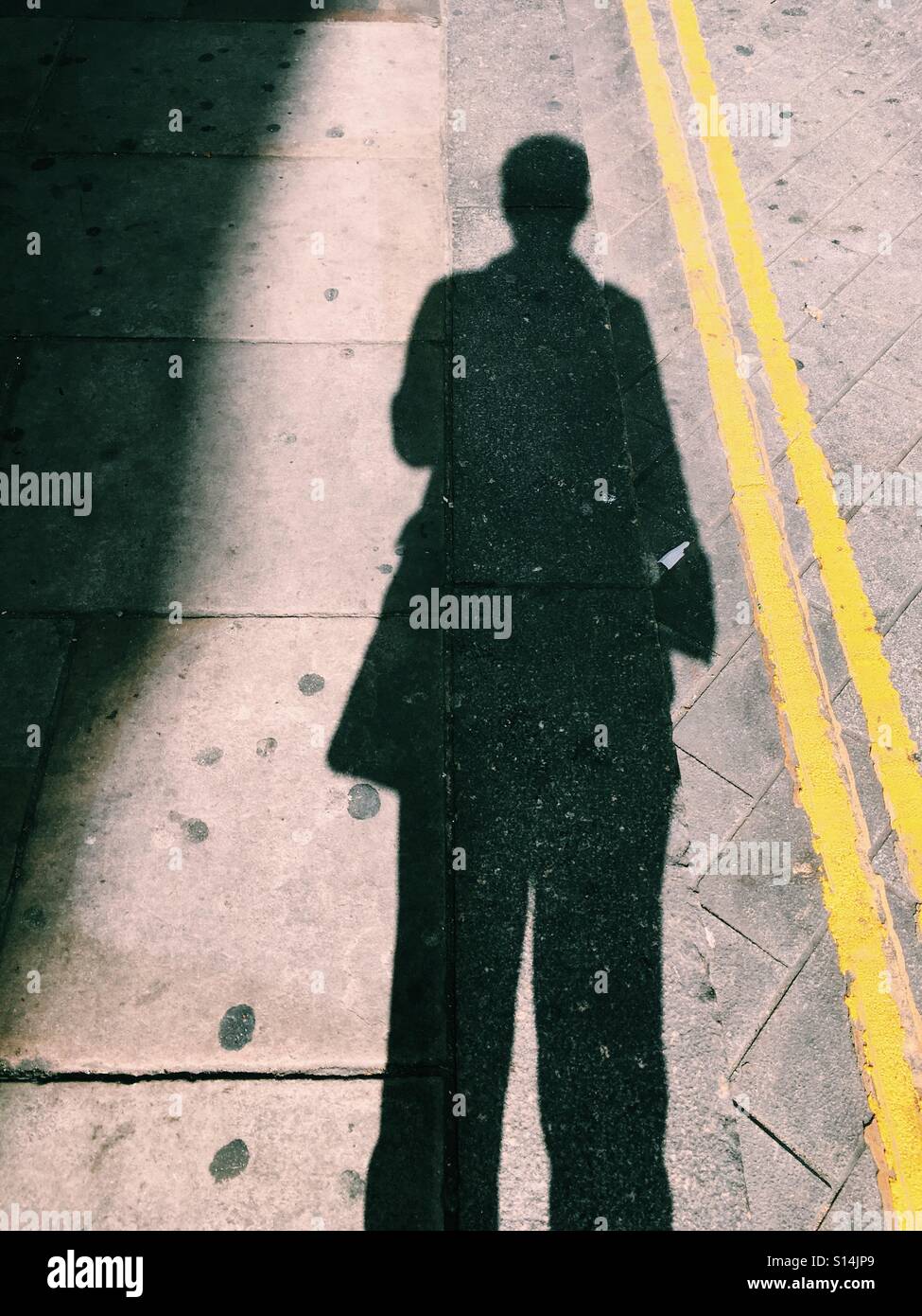 Shadow of a man Stock Photo - Alamy