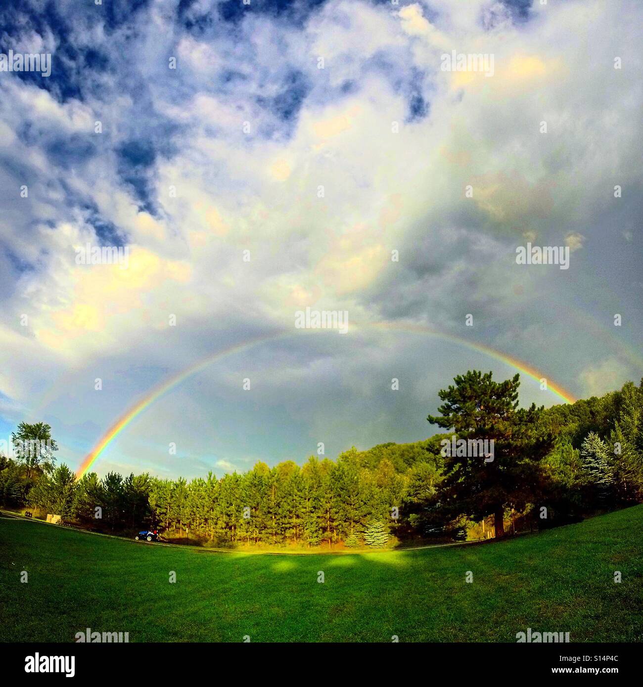 Rainbow with cloud hi-res stock photography and images - Alamy