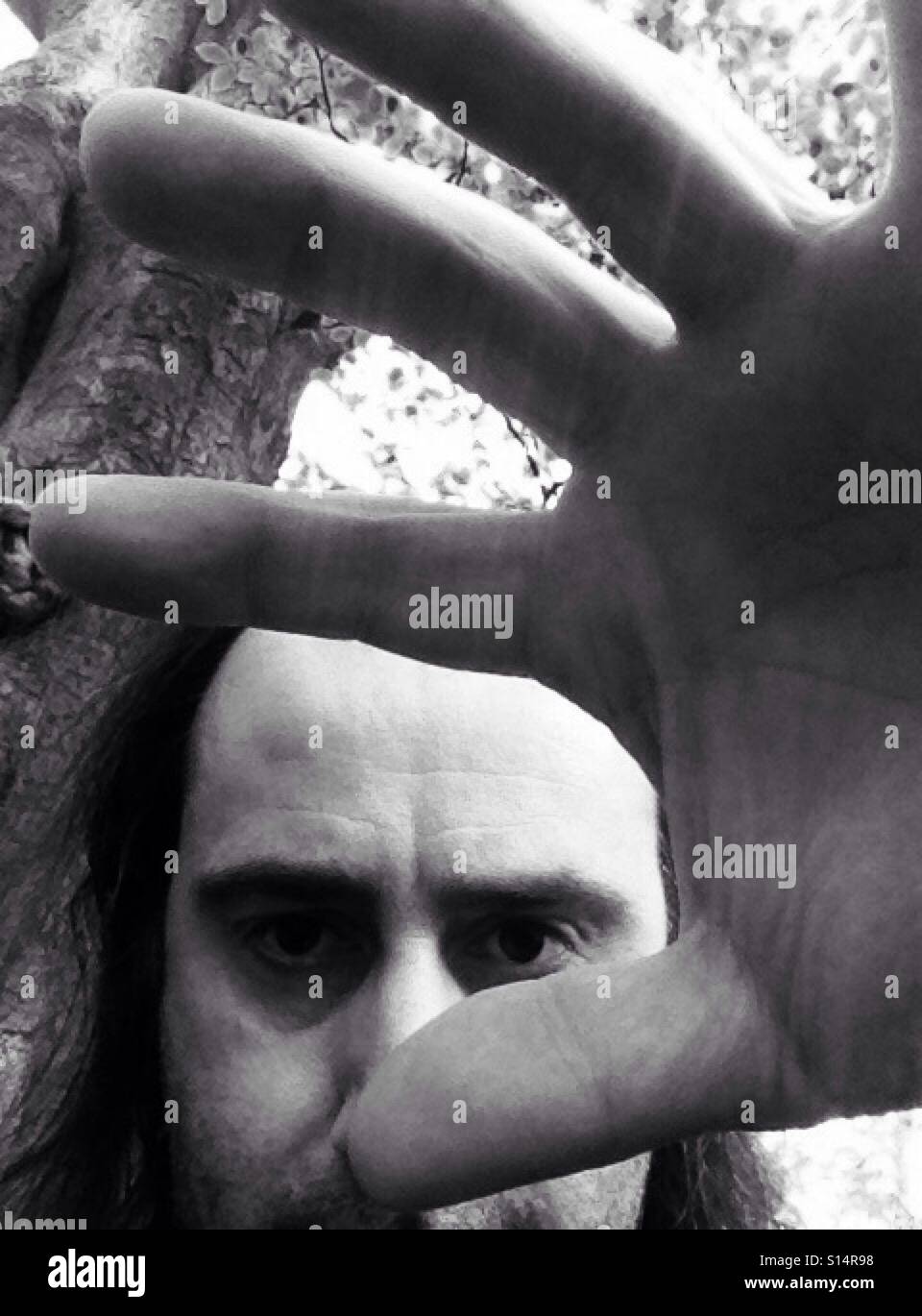 Hand and face Stock Photo - Alamy