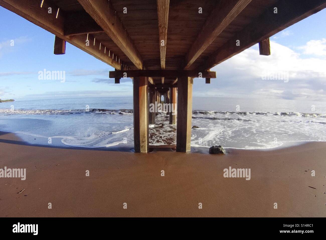 Under the pier Stock Photo - Alamy