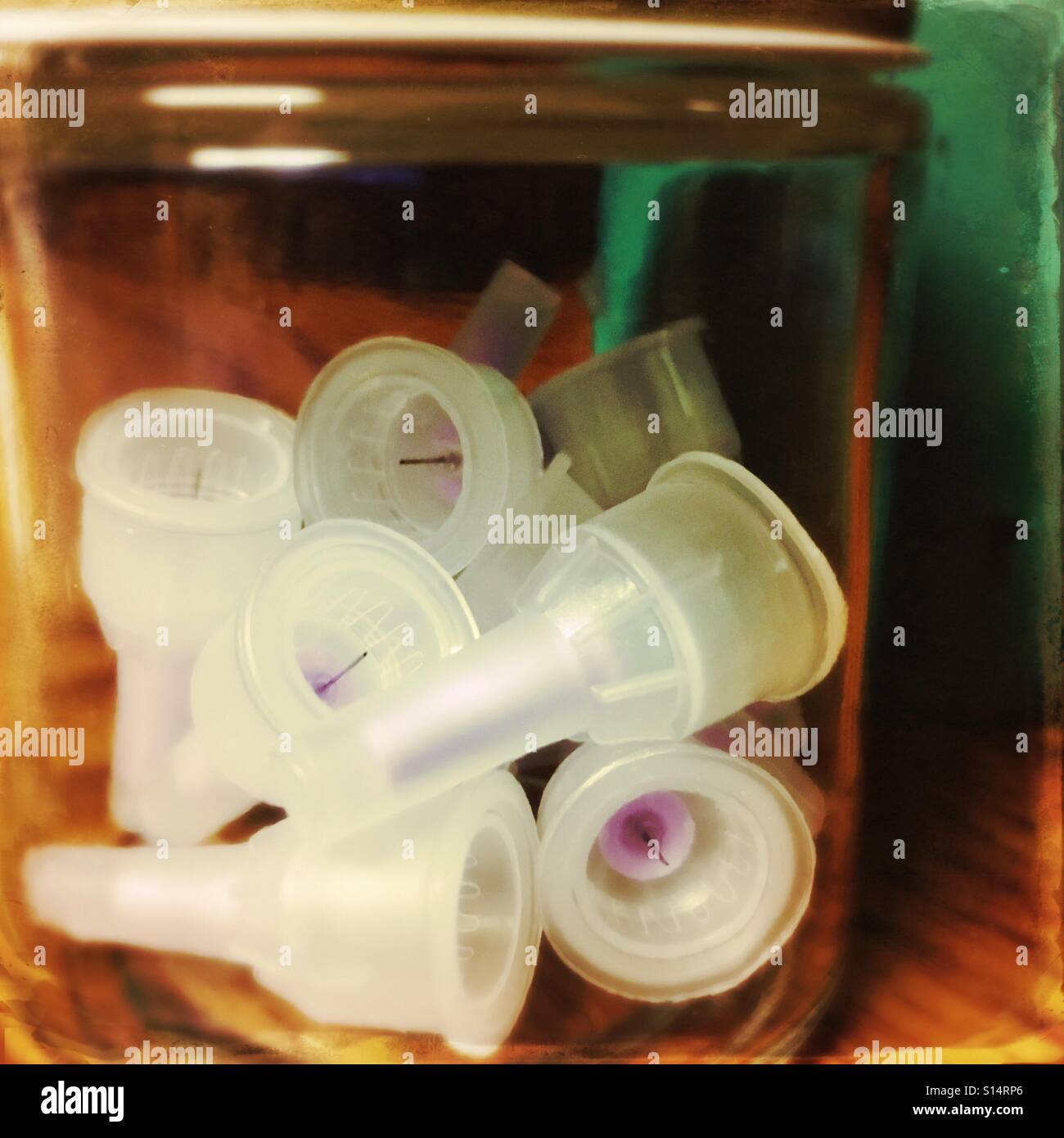 A jar of used insulin needles Stock Photo - Alamy