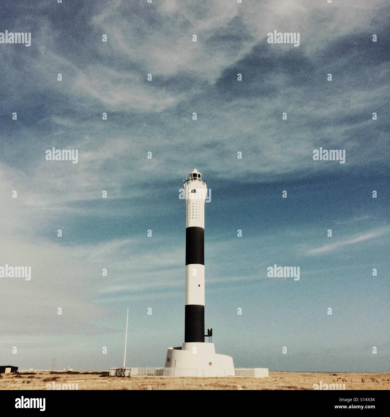 Dungeness lighthouse Kent coastline England UK Stock Photo - Alamy