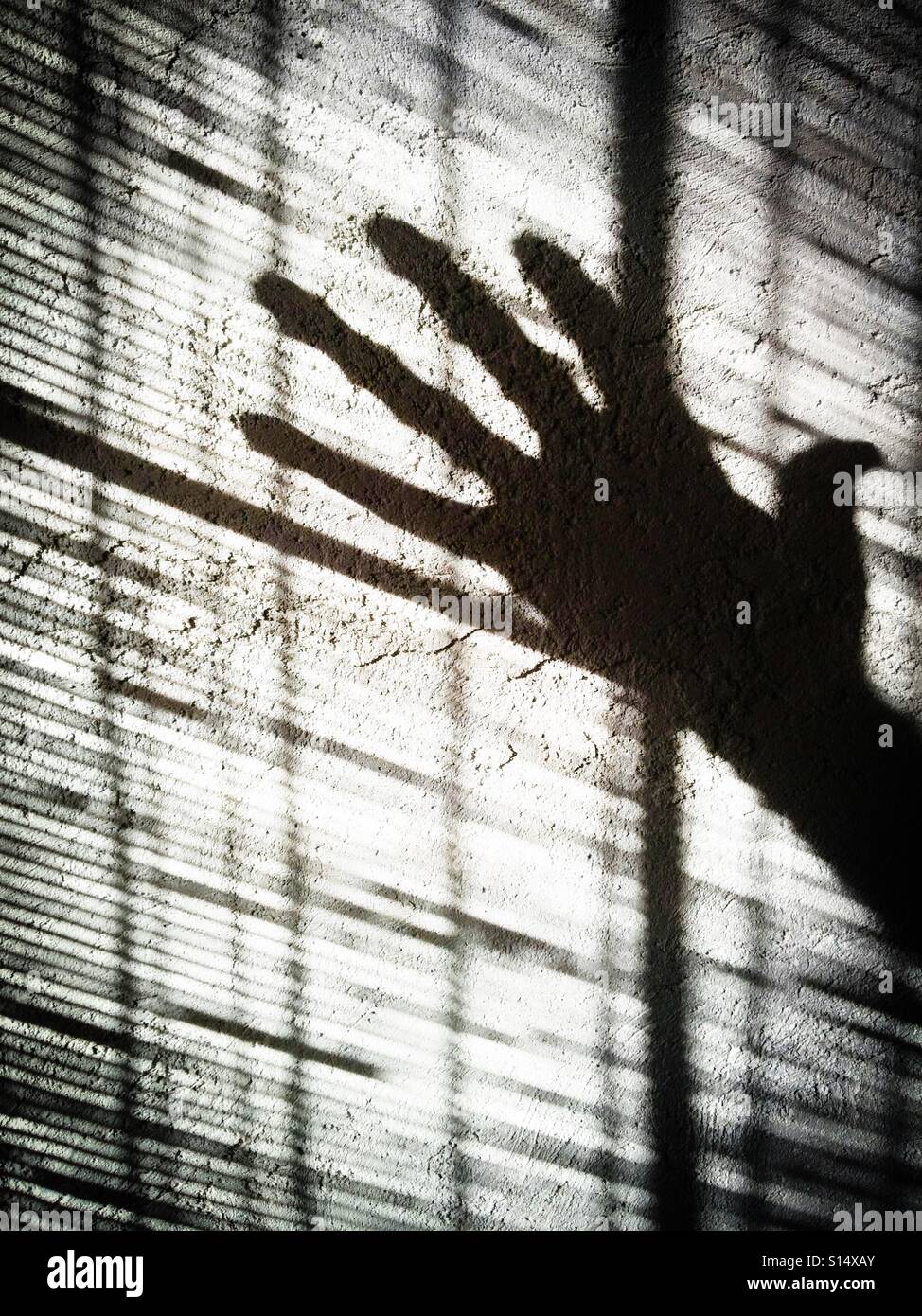 Scary shadow arm hi-res stock photography and images - Alamy