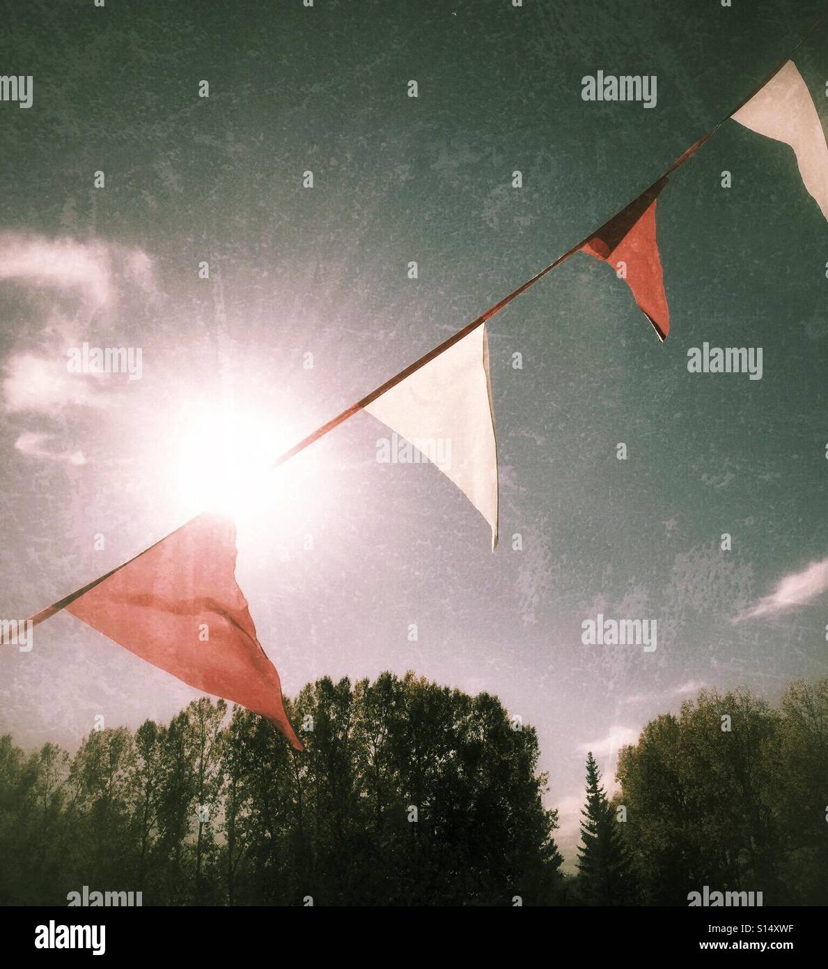 Backlit pennants blow in the wind Stock Photo - Alamy