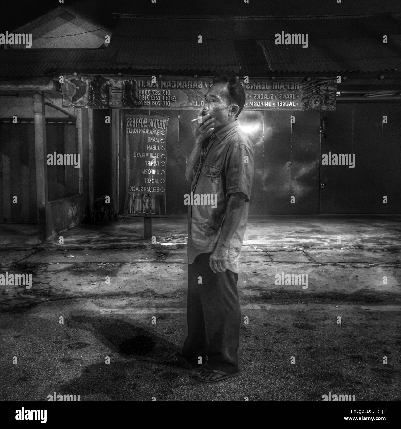 Man smoking at night hi-res stock photography and images - Alamy