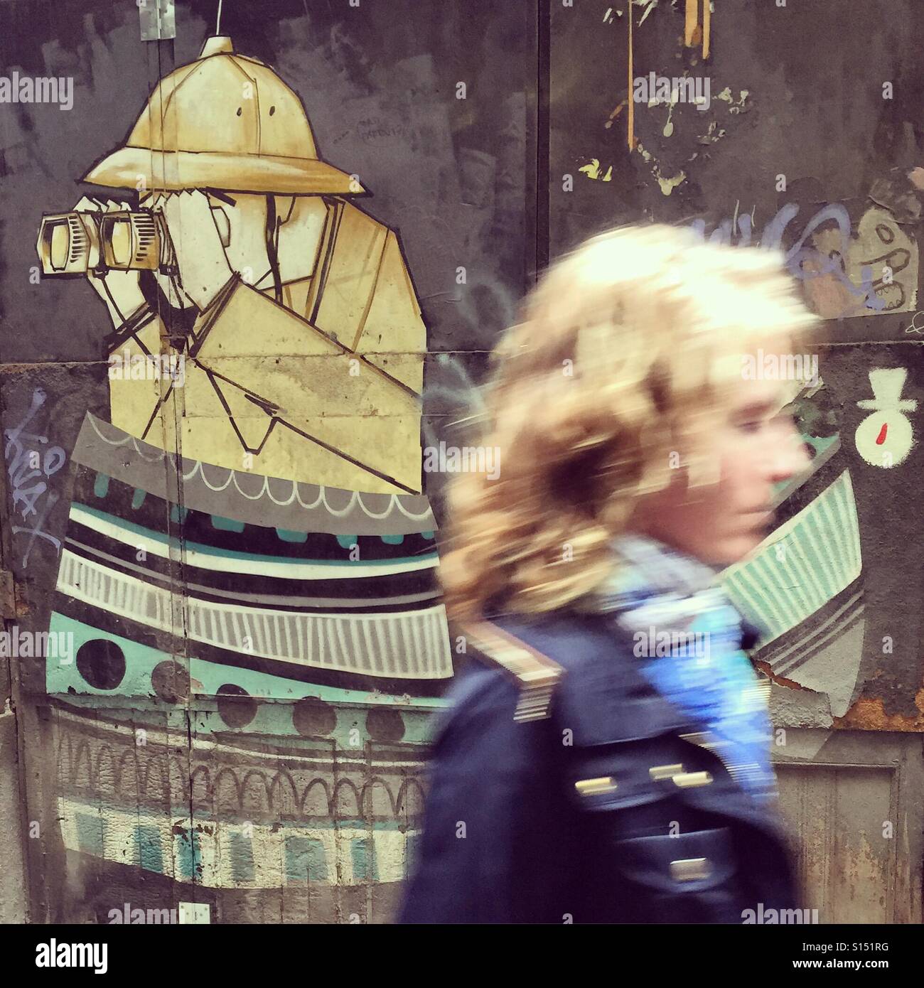 Woman walking through narrow street hi-res stock photography and images ...