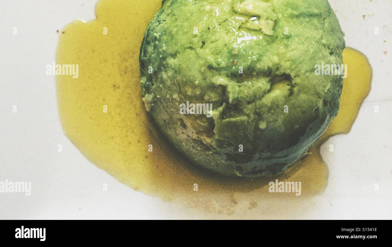 Avocado in olive oil and pink salt Stock Photo - Alamy