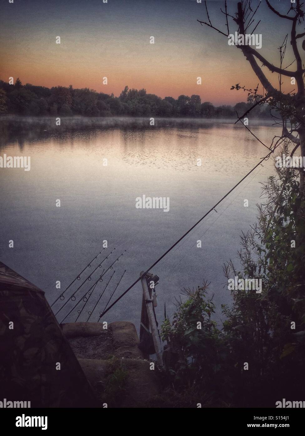 Fishing on lake Stock Photo - Alamy