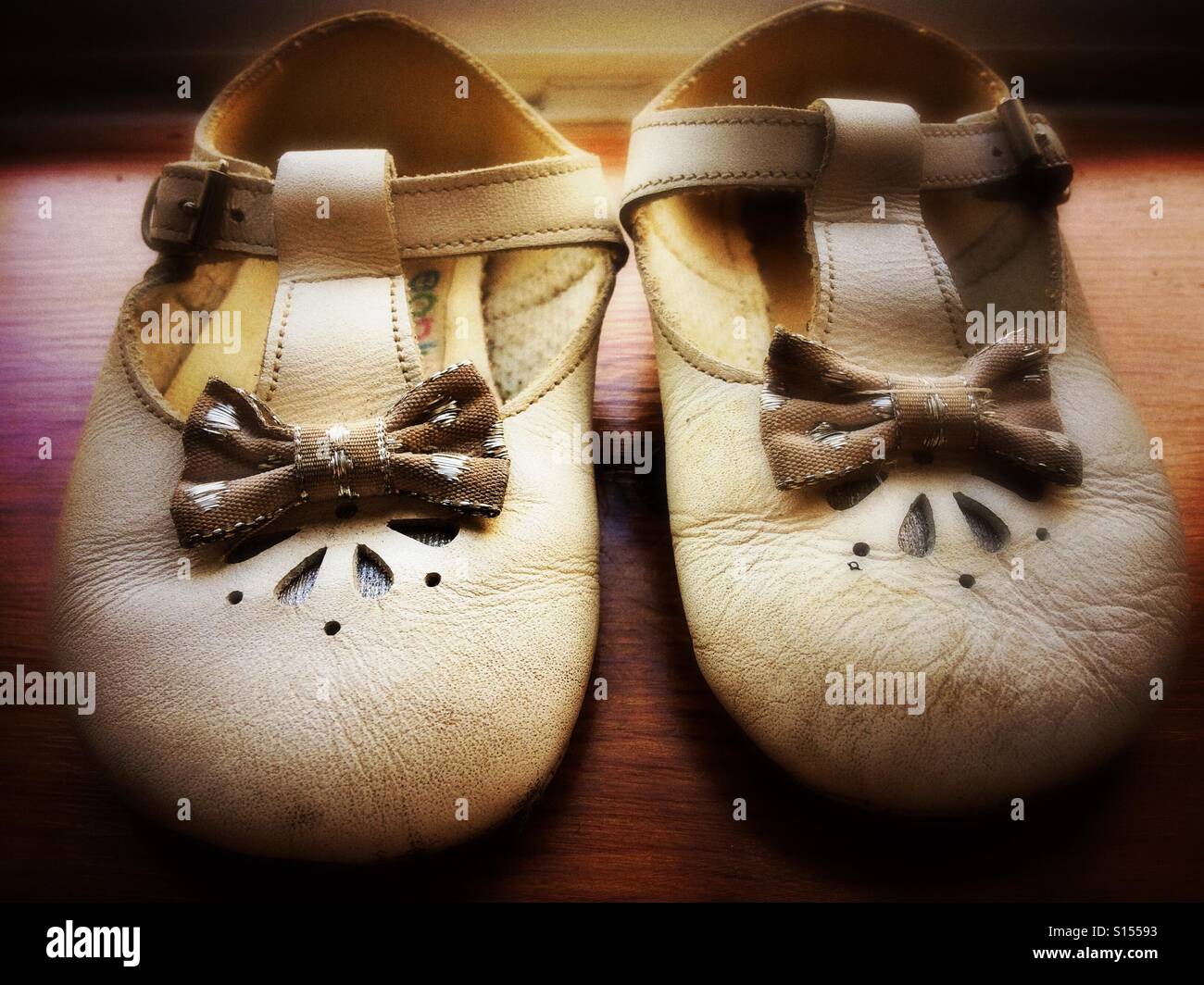 Old worn baby shoes hi-res stock photography and images - Alamy
