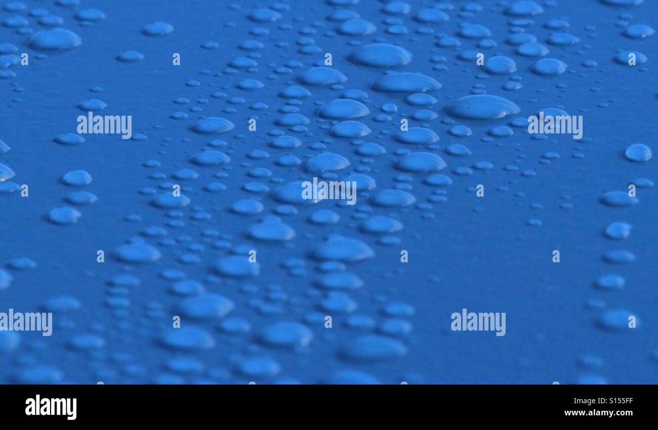 Blue paint drops smartphone stock photos and images - Alamy