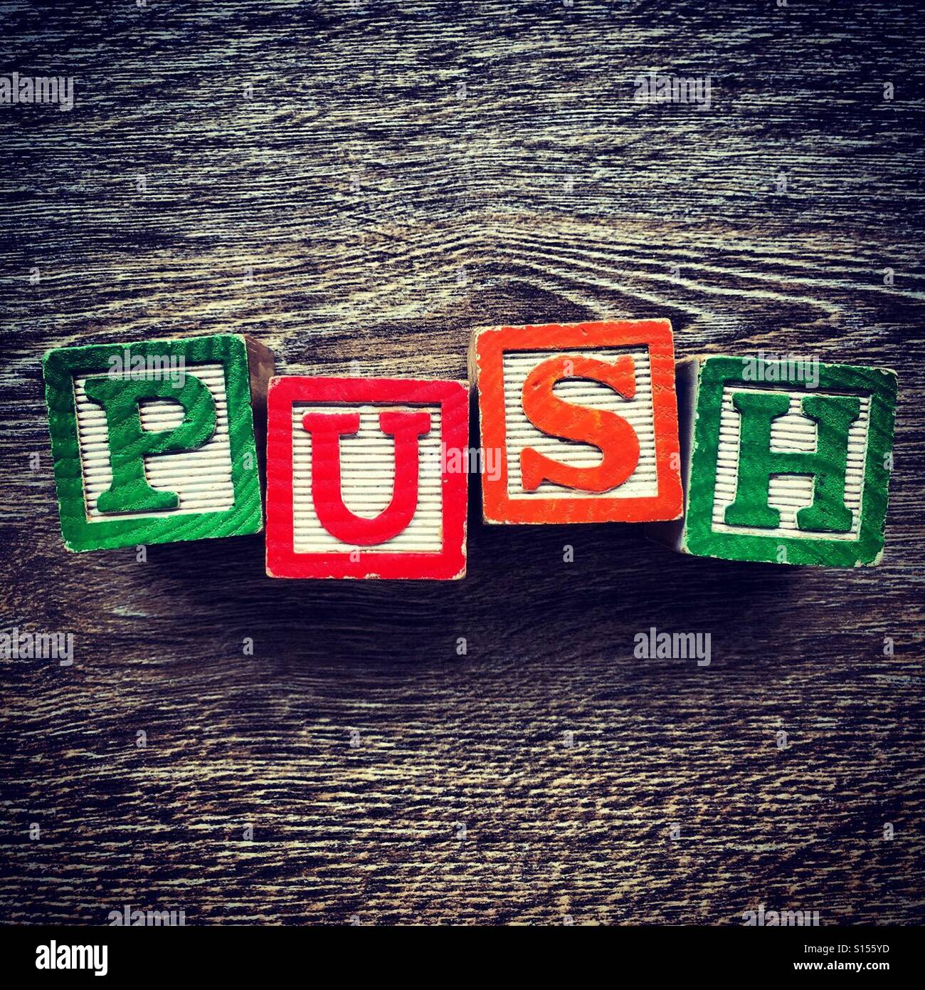 PUSH word written with wood block letter toys Stock Photo - Alamy