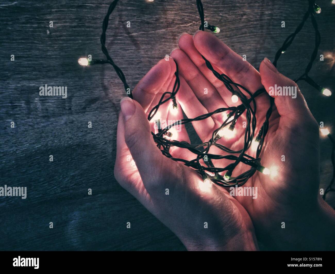 Hands and lights Stock Photo - Alamy