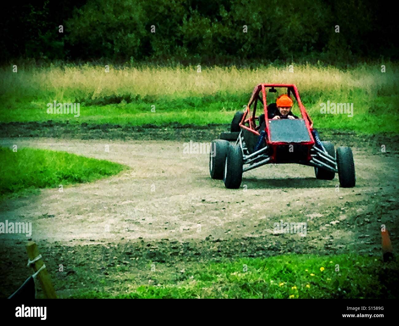 A man driving an off-road buggy Stock Photo - Alamy