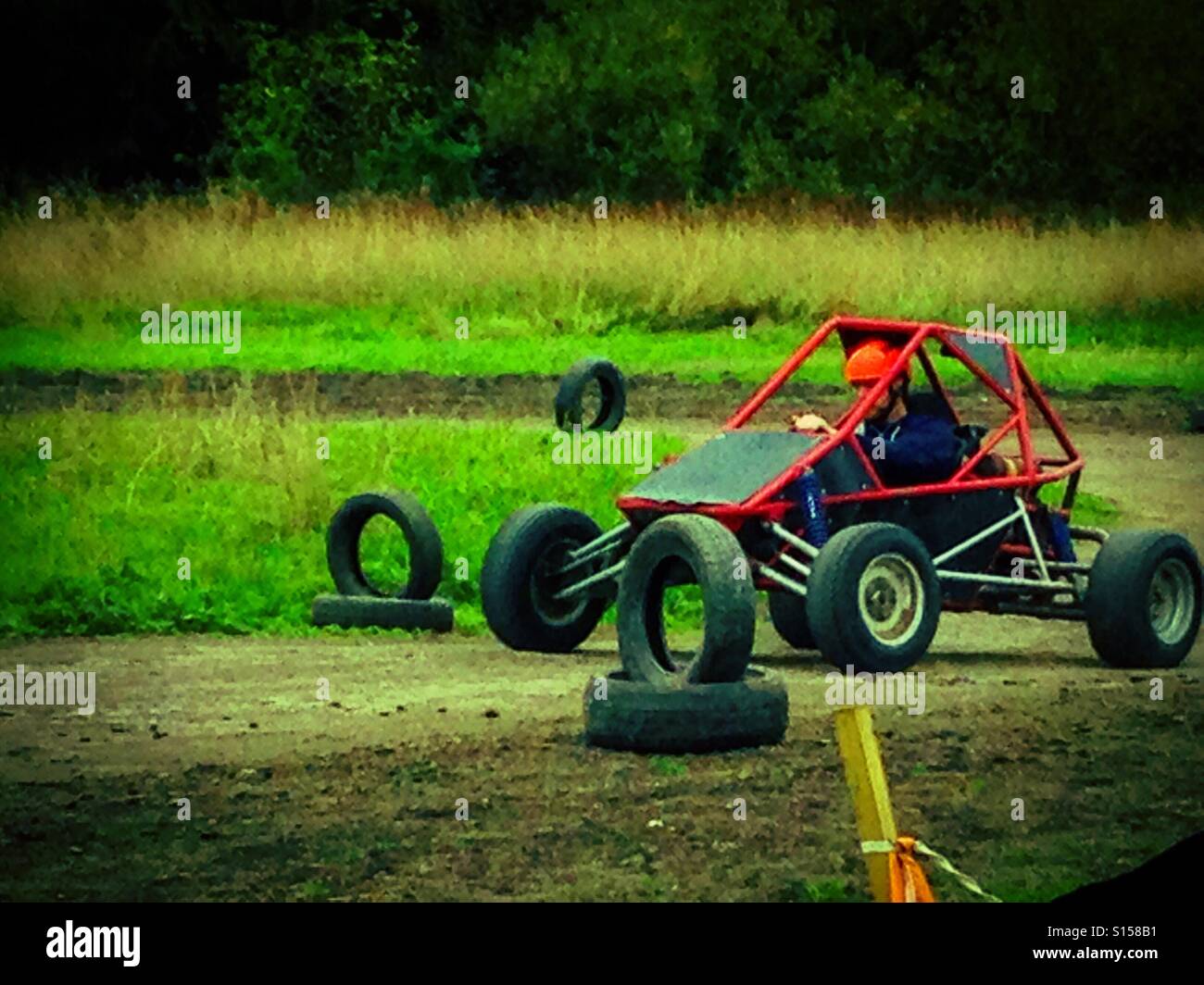 A mans driving an off-road buggy Stock Photo - Alamy