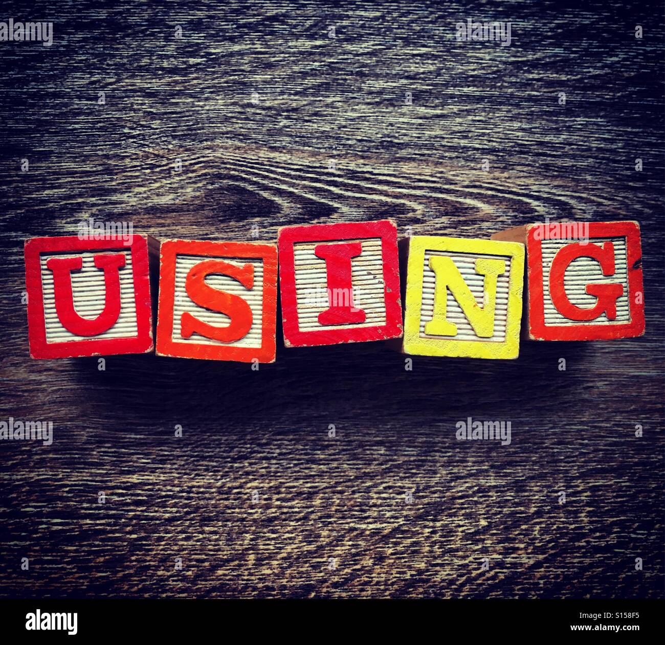 USING word written with wood block letter toys Stock Photo - Alamy