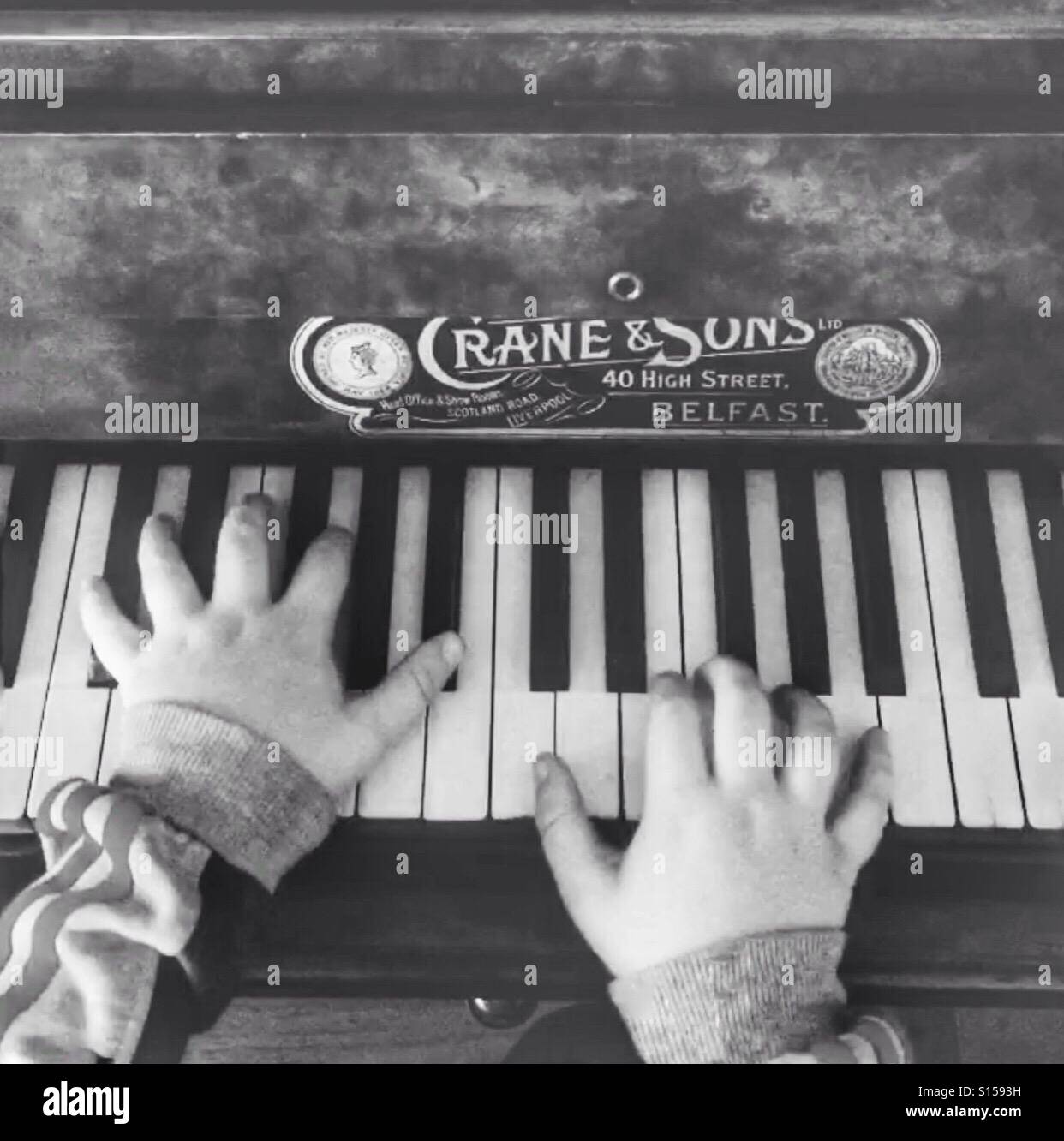 Child playing piano hi-res stock photography and images - Alamy