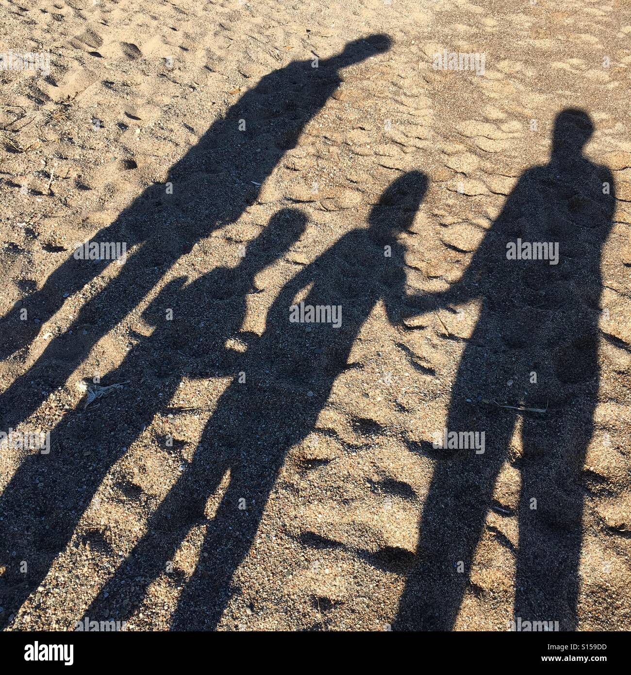 Shadow Of A Family With Two Teens