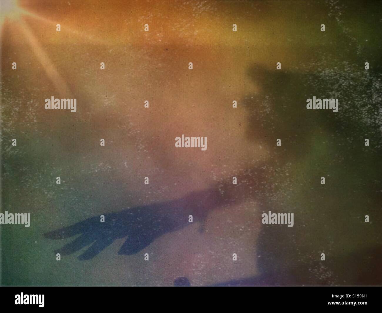 Shadow projected onto wall Stock Photo - Alamy