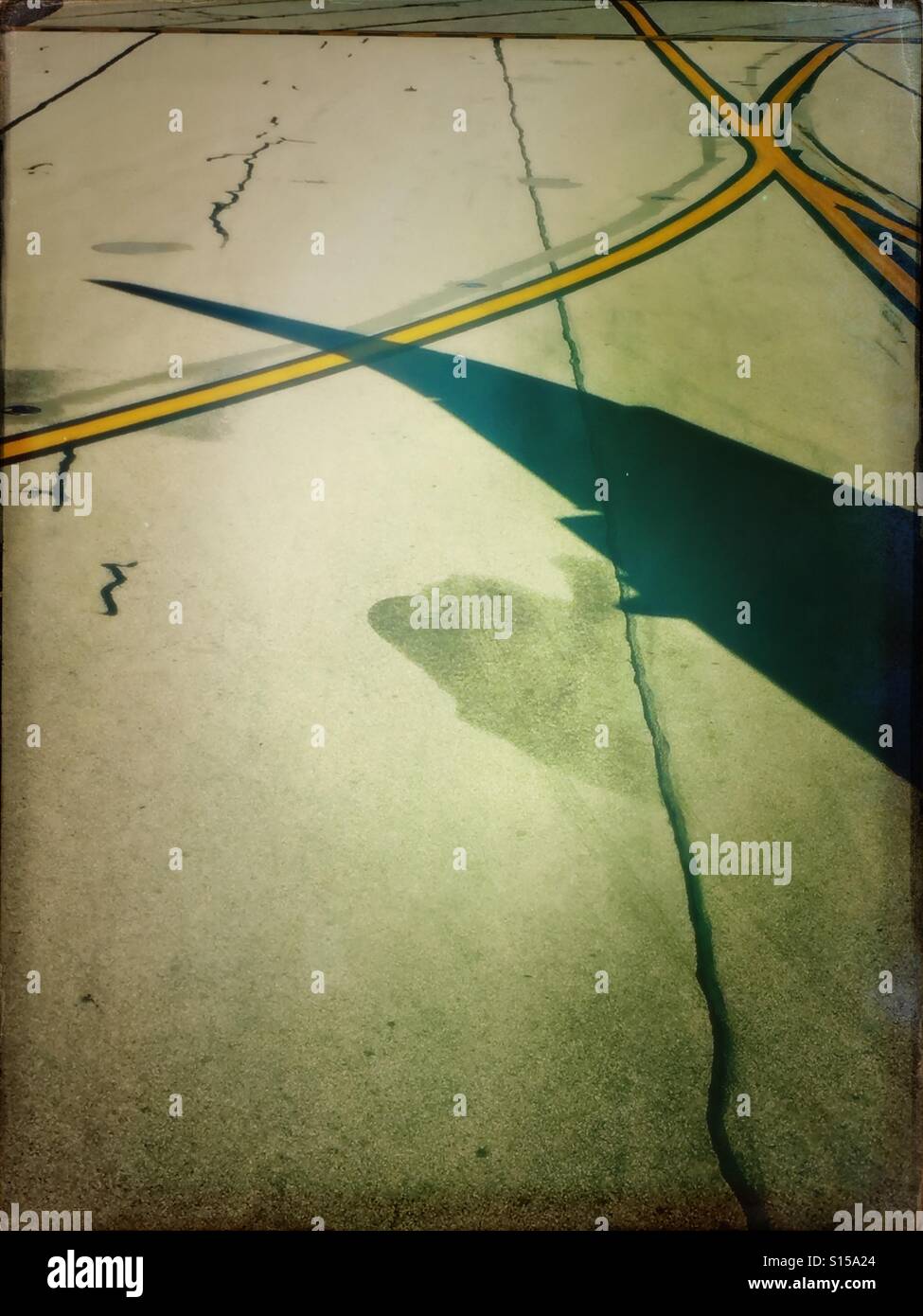 Airplane wing shadow on tarmac Stock Photo - Alamy