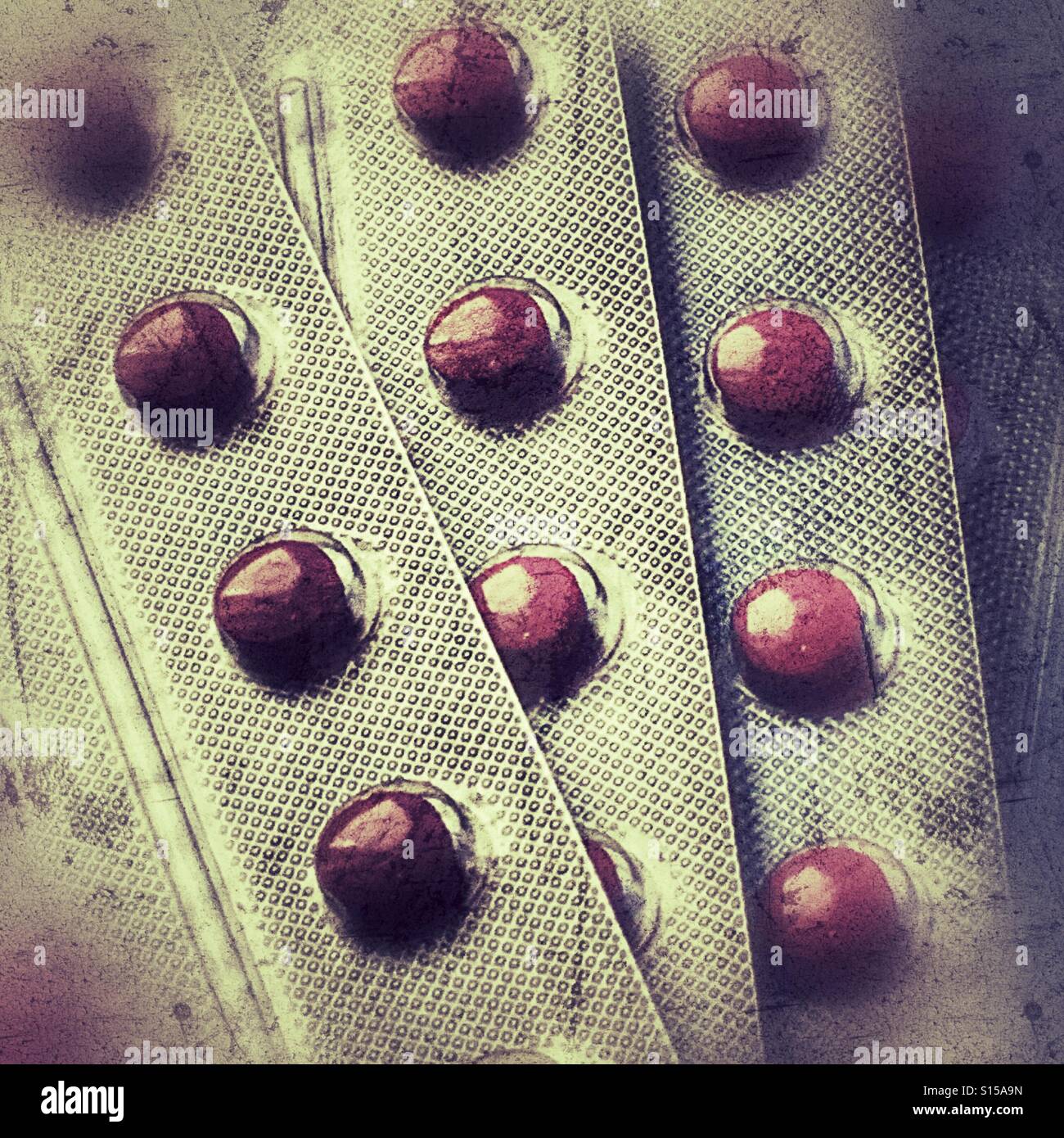 Red tablets in a blister pack Stock Photo - Alamy