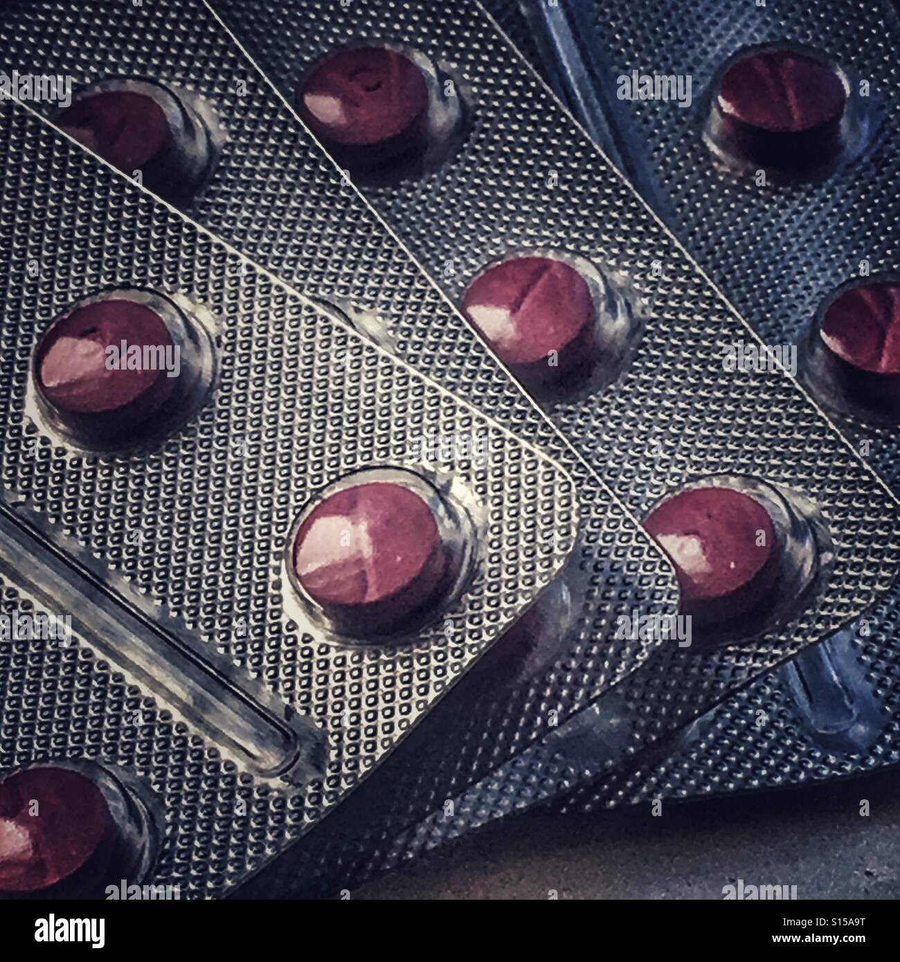 Red tablets in blister packs Stock Photo - Alamy