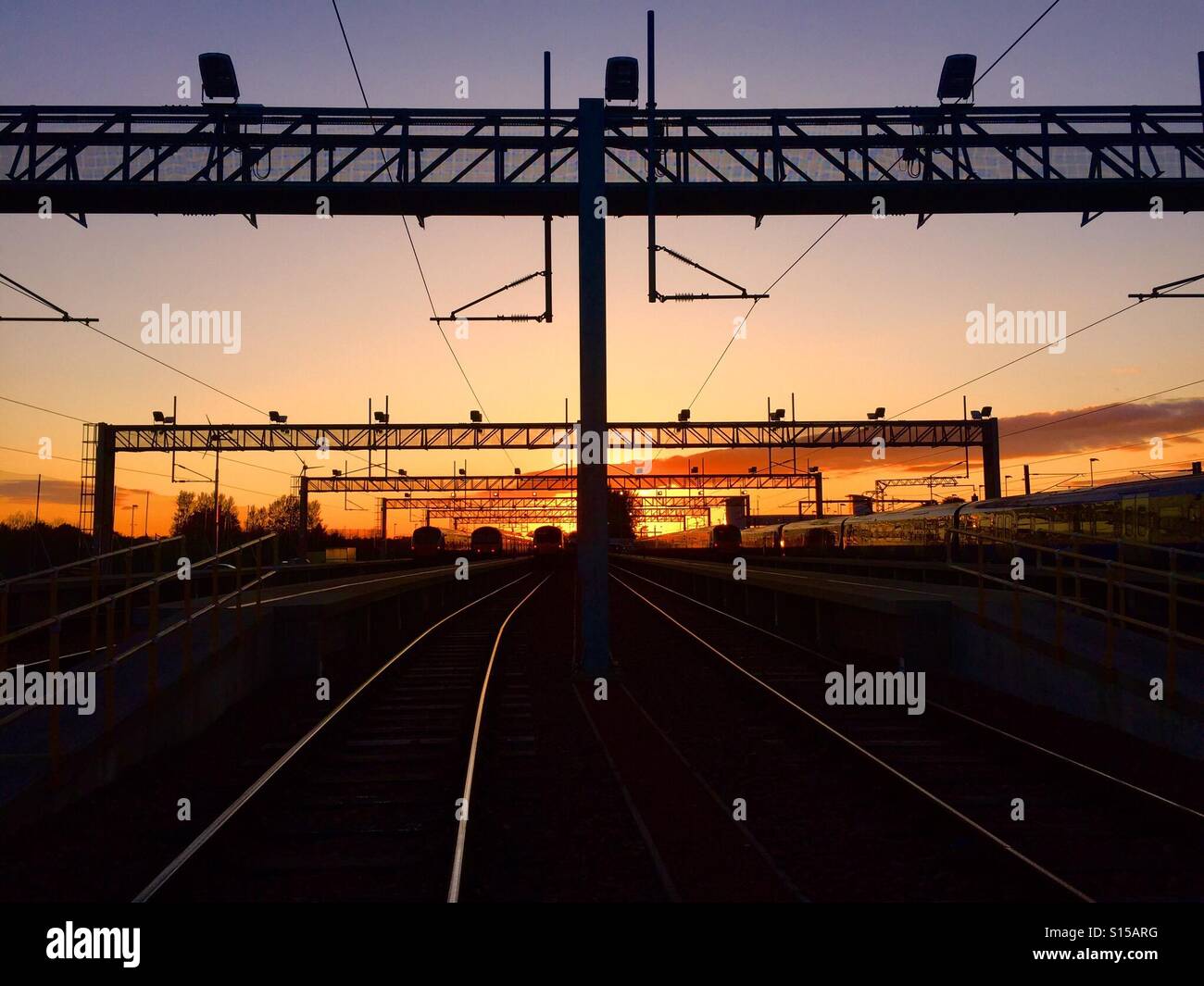 Railway Depot at Sunset Stock Photo - Alamy