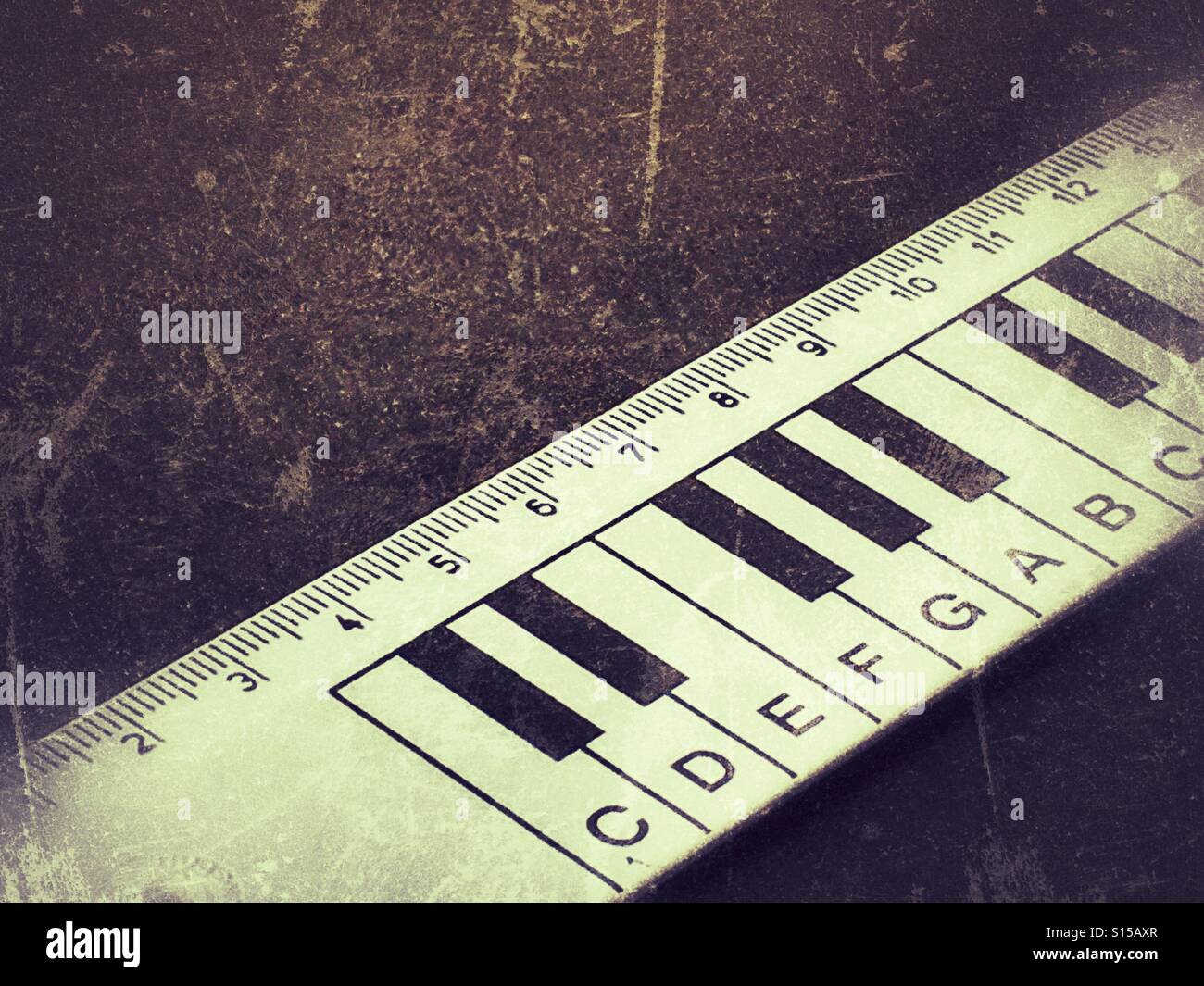 A ruler with measurements in centimetres and musical note scales Stock ...