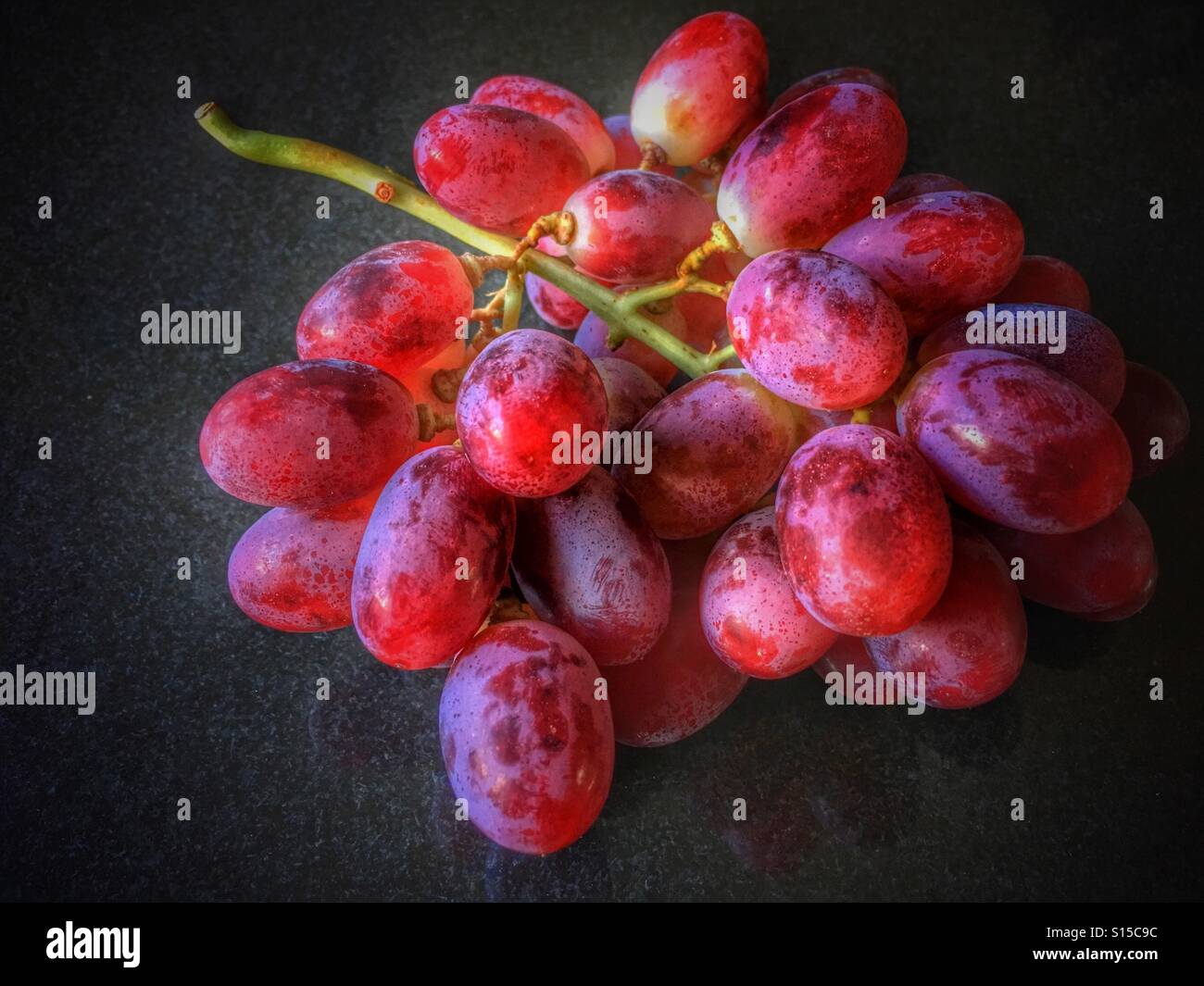 Beautiful bunch of red juicy grapes Stock Photo - Alamy