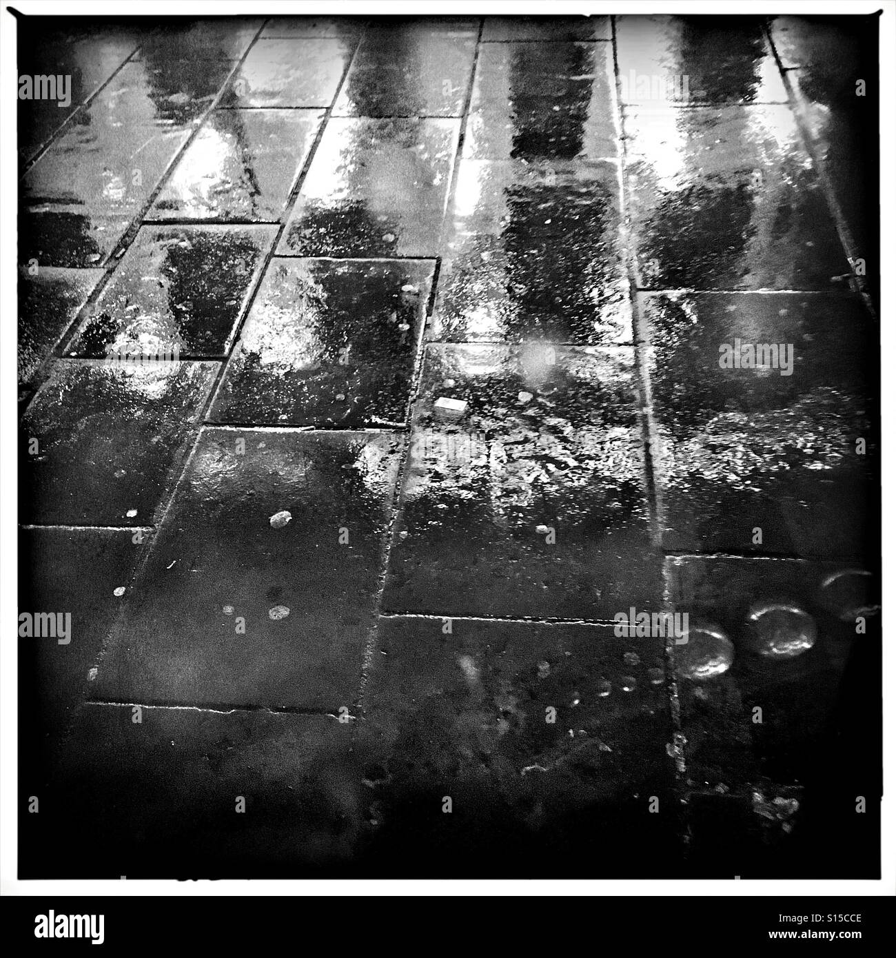 Wet rainy pavement hi-res stock photography and images - Alamy