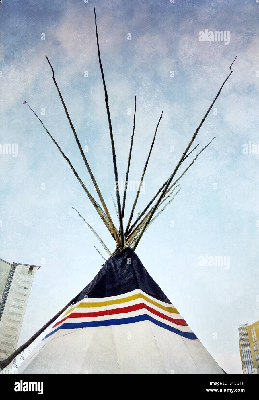 A native North American teepee stands among modern skyscrapers Stock ...