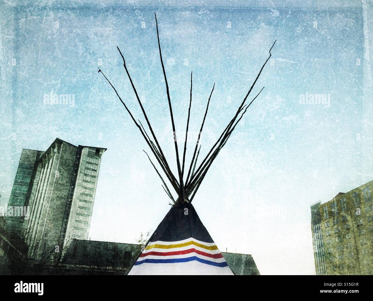 A native North American teepee stands among modern skyscrapers Stock ...