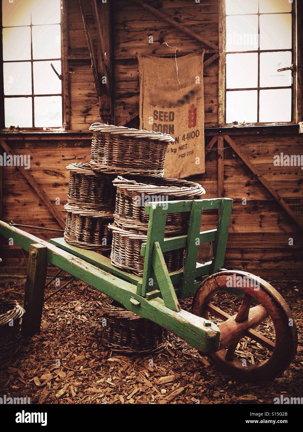 Vintage wheelbarrow wood hi-res stock photography and images - Alamy
