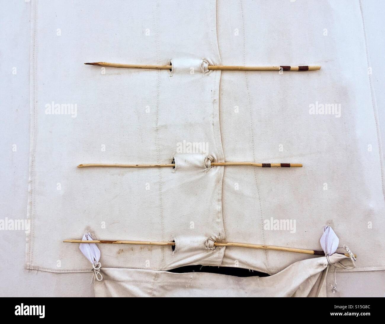 Decorative sticks tucked through a First Nations teepee above the flap ...