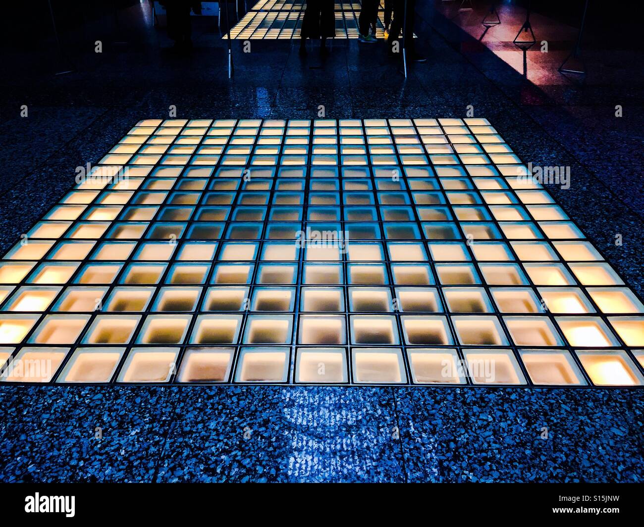 Floor with lit squares Stock Photo - Alamy
