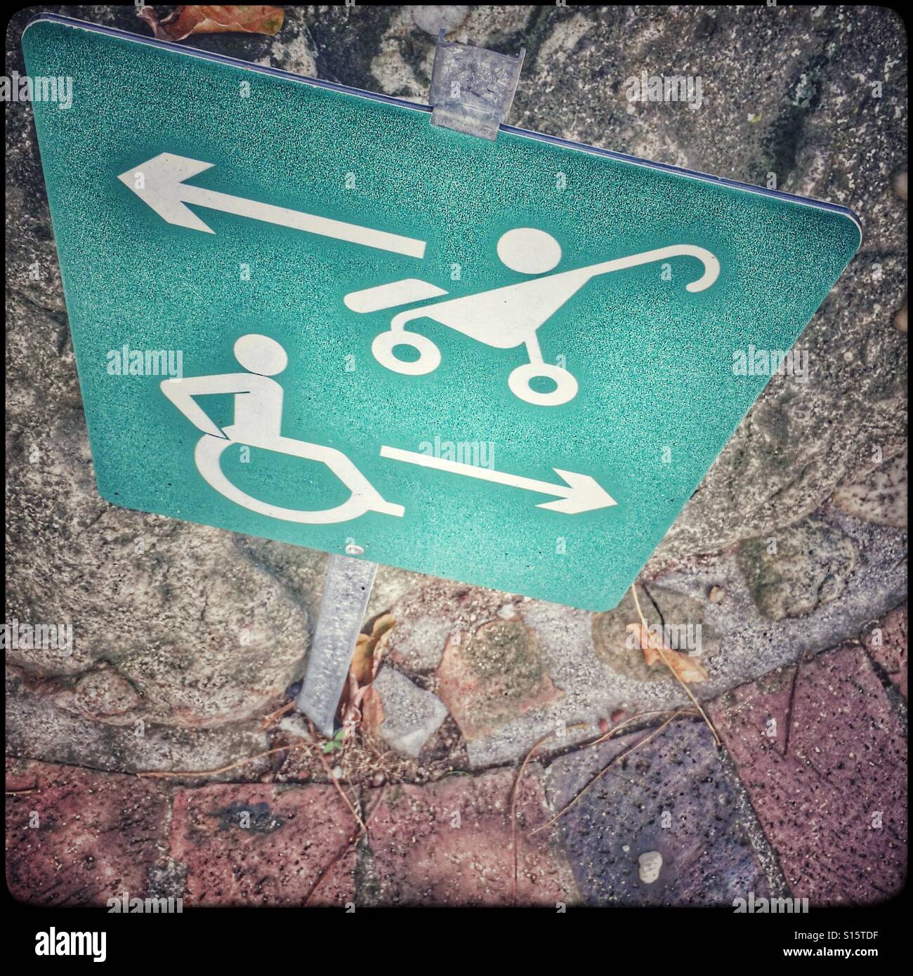 Wheelchair and pushcart access sign Stock Photo - Alamy