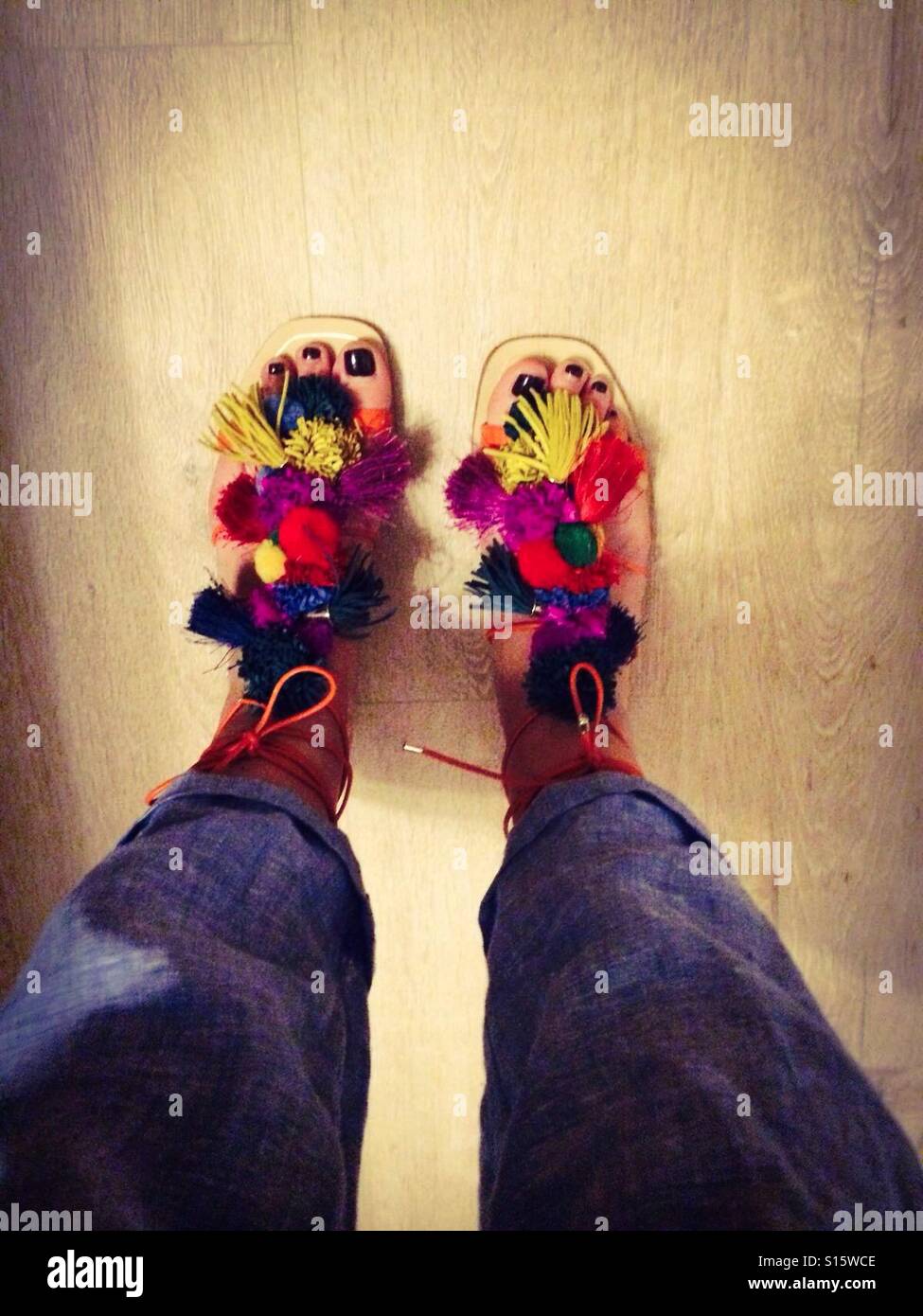 feet with fun colourful trendy shoes Stock Photo - Alamy