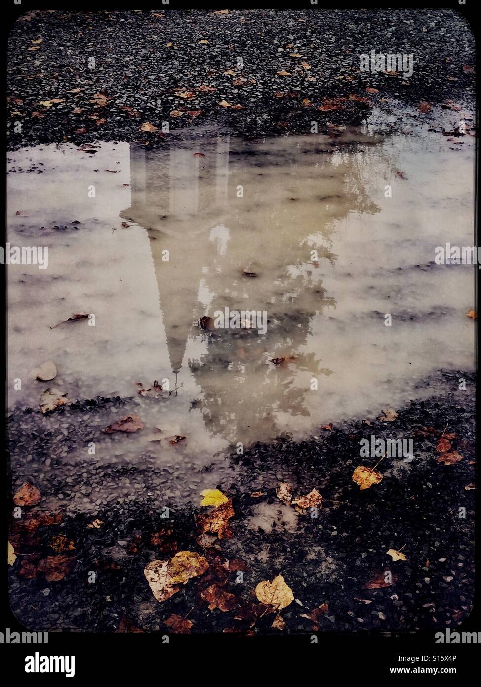 The steeple of the historic Elbe Lutheran Church is reflected in a rain ...