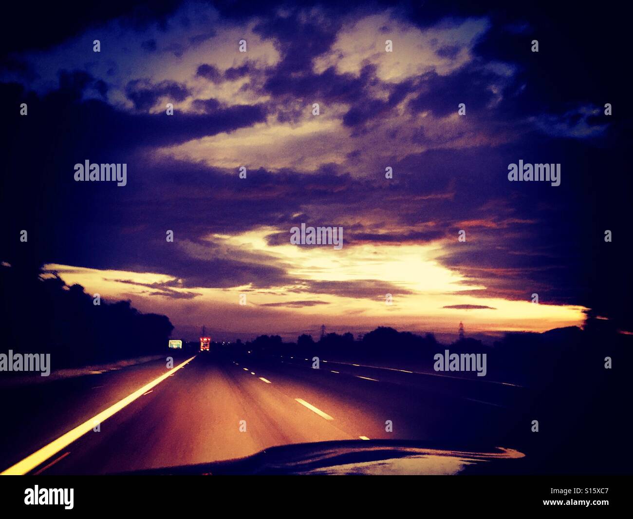 Motorway at dusk and sunset Stock Photo - Alamy